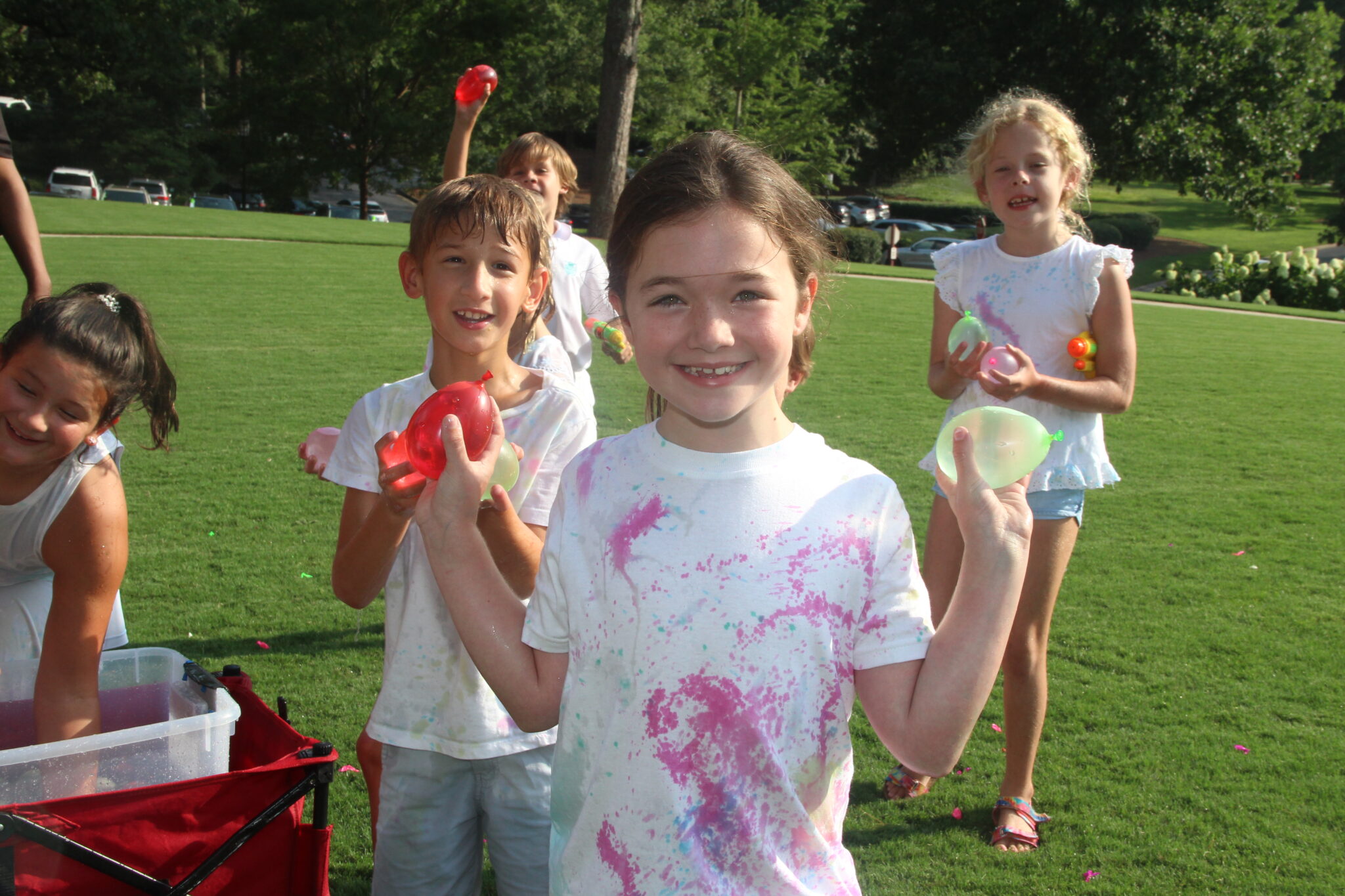 Kids Cool Off In Water Gun Color War - Club + Resort Business