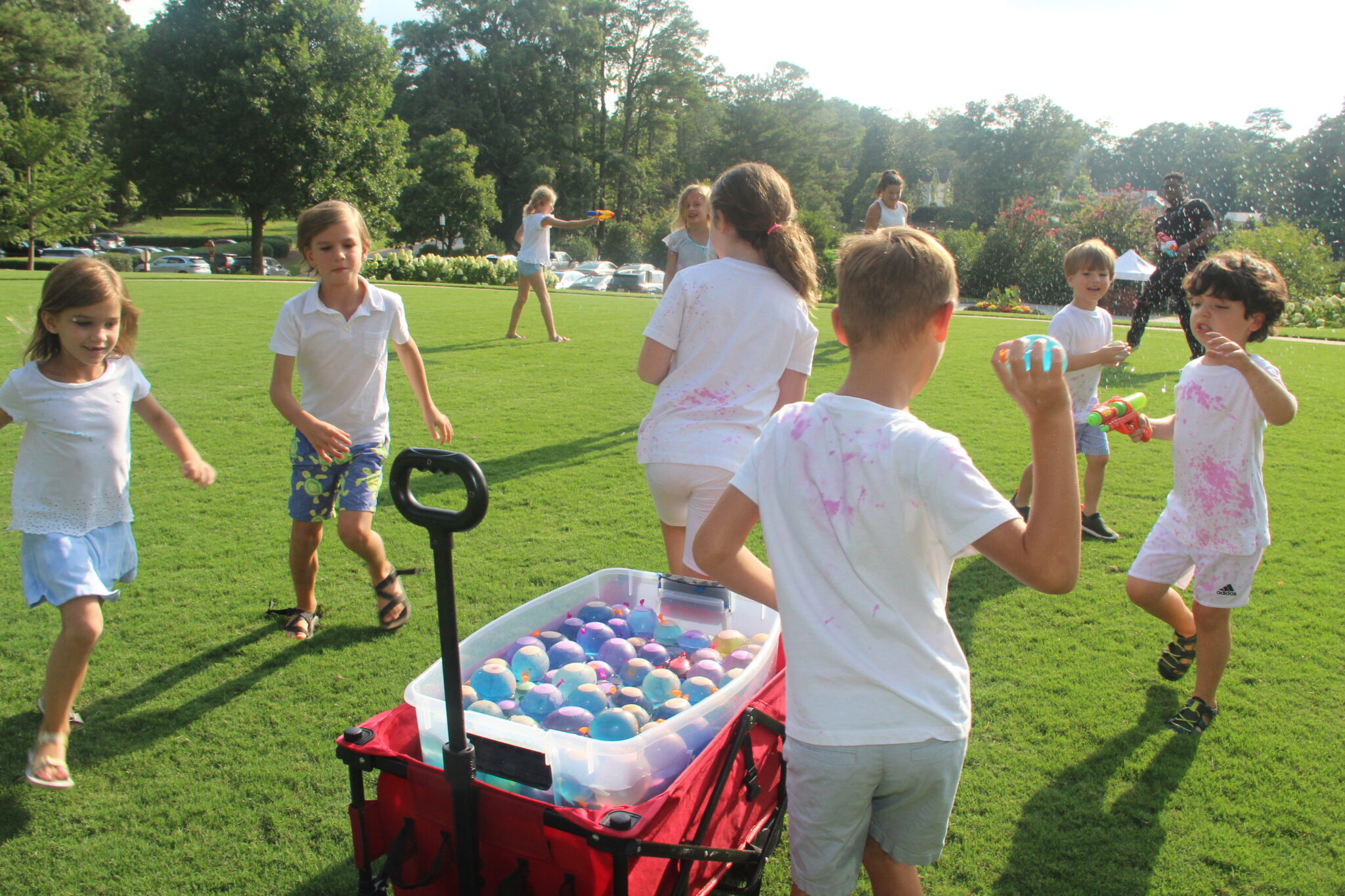 Kids Cool Off In Water Gun Color War - Club + Resort Business